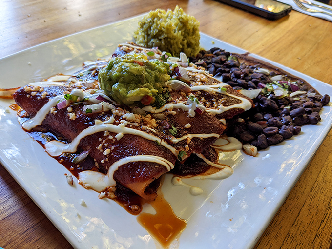 These enchiladas aren't just rolled tortillas&mdash;they're flavor torpedoes loaded with savory goodness and drizzled with sauce that demands to be savored.