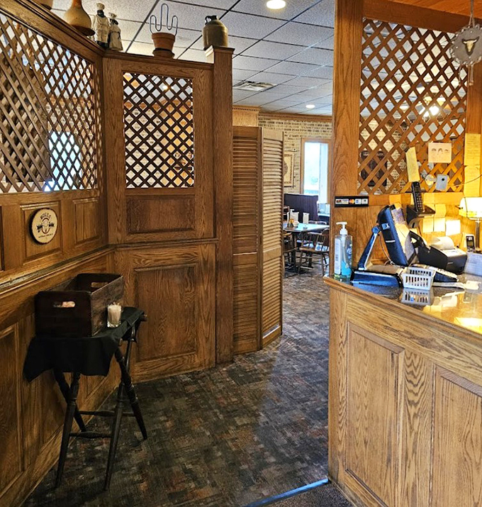 The wooden lattice dividers and host station create that perfect transition from outside world to dining sanctuary.