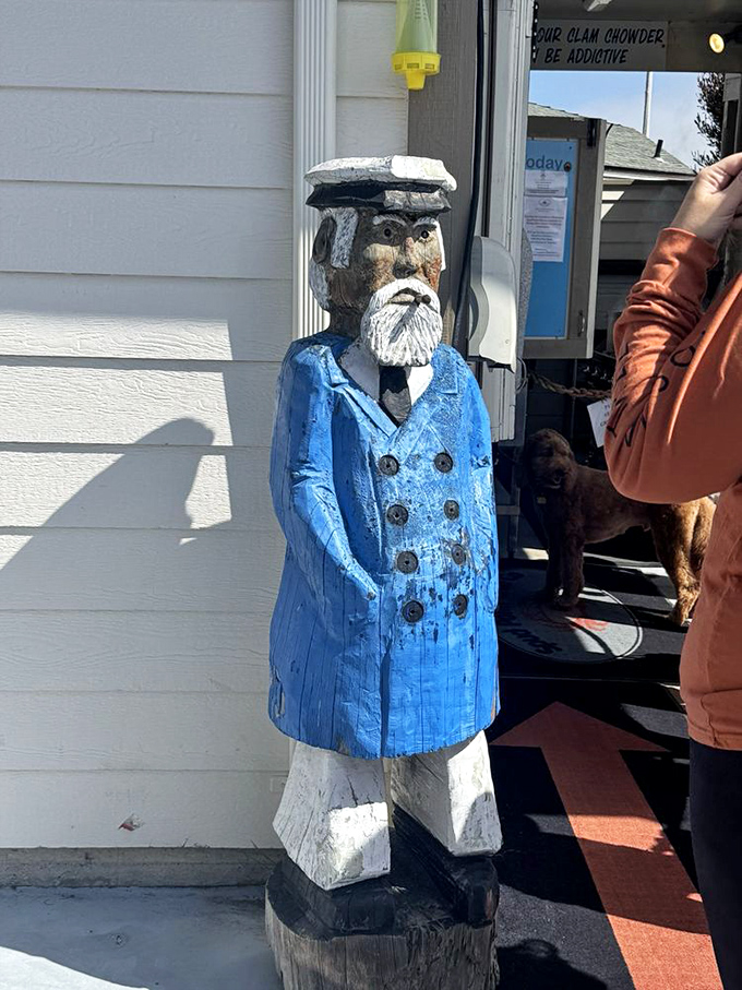 Even the wooden sea captain approves of the fresh catches served at this harbor.