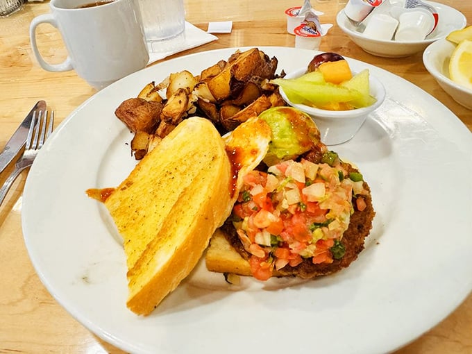 Fiesta Ranchero brings a morning mariachi band of flavors to your palate, proving breakfast knows no borders at Peach Valley Cafe.