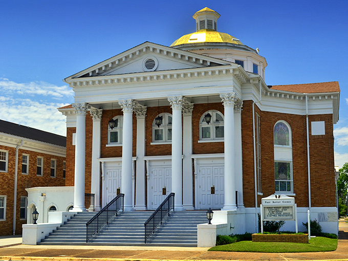 First Baptist Church's impressive columns and golden dome reach skyward, a spiritual landmark that anchors the community in more ways than one.