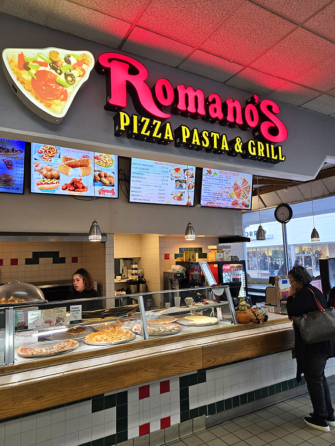 Romano's Pizza stands ready to silence the hunger pangs that inevitably strike halfway through your shopping expedition.
