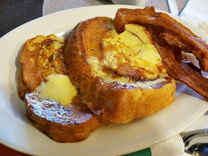 French toast that makes you question why you ever settled for lesser versions. Thick-cut, golden-brown, and ready for its maple syrup bath.