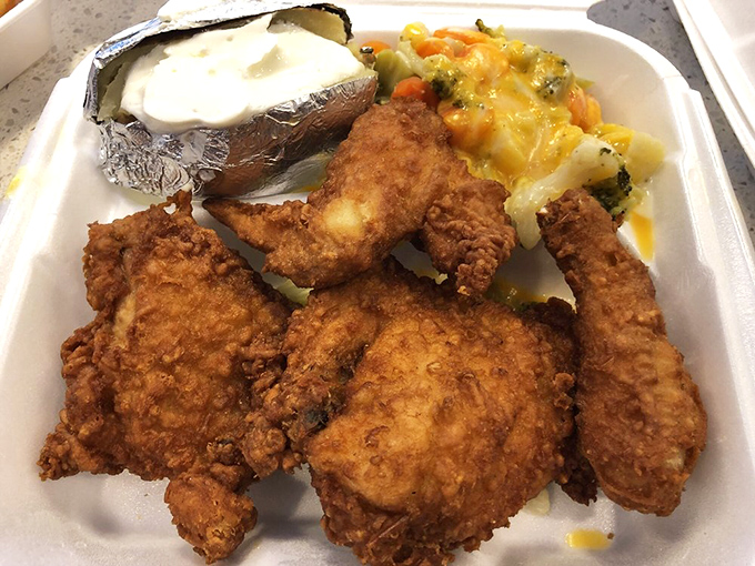 Fried chicken that crackles with each bite, served with sides that understand their supporting role in this crispy, golden main attraction.