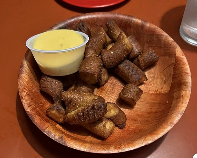 Pretzel bites that have achieved the perfect balance &ndash; crispy exterior, soft interior, and that honey mustard for the win.