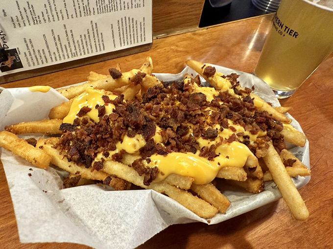 These loaded fries don't just speak&mdash;they sing. Cheese sauce and bacon bits transform humble potatoes into a main event.