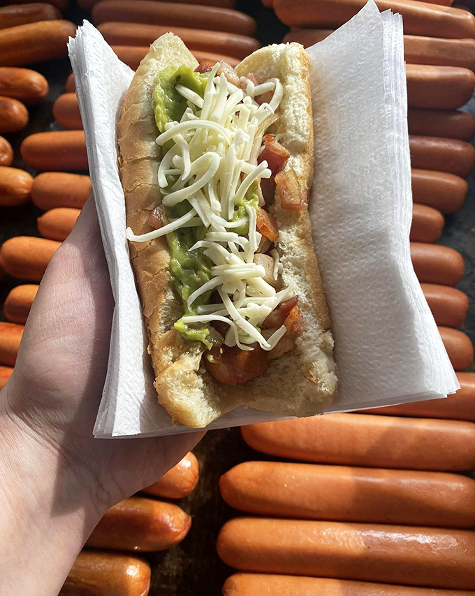 Sauerkraut and cheese create the perfect tangy-creamy balance. A hot dog that understands the importance of contrasting flavors and textures.