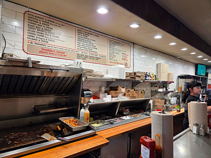 Sandwich assembly line that operates with surgical precision. The grill masters here have elevated lunch to an art form.