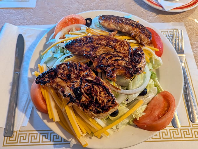 A salad that doesn't feel like punishment. Grilled chicken with actual grill marks atop a bed of cheese and veggies&mdash;healthy-ish never looked so good.