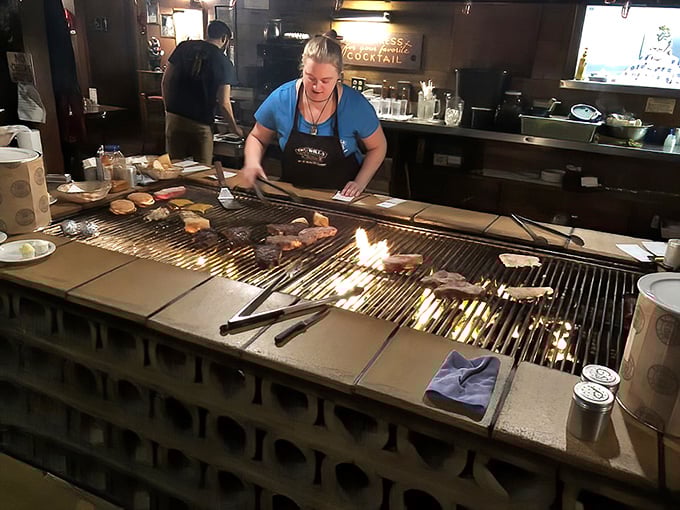 At the grilling station, steaks sizzle and smoke rises like delicious incense in this temple dedicated to the art of perfect beef.