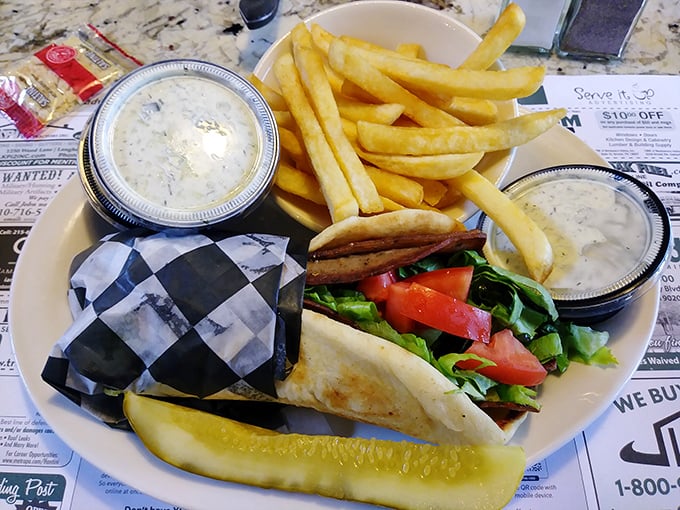 This isn't just a sandwich&mdash;it's a gyro that demands to be respected, with meat, sauce, and a pickle standing guard like it knows how good it is.