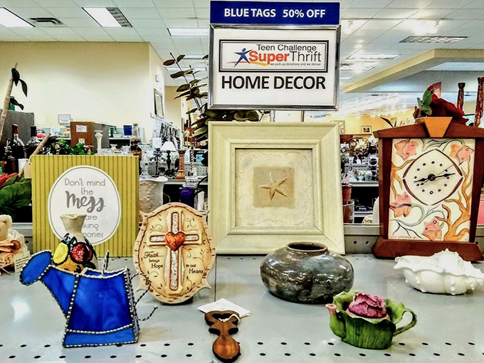 Home d&eacute;cor treasures arranged with care. That blue watering can is just begging to become someone's whimsical indoor planter.