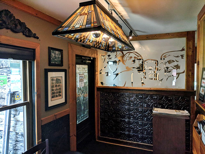 Vintage lighting and presidential silhouettes create an atmosphere that whispers "stay awhile" before you've even ordered your first drink.