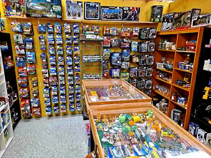 Star Wars meets Hot Wheels in this collector's dream corner. The carefully arranged display cases protect childhood memories that have appreciated in both value and nostalgia.