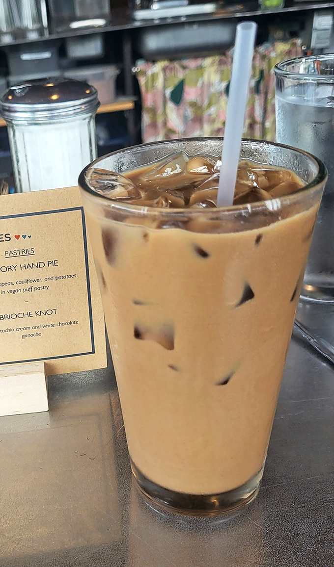 The iced coffee stands tall and proud, ready to jolt you into the day with its caffeinated embrace.