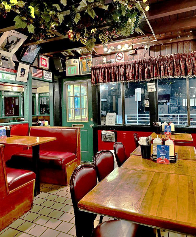 Fake grape vines hanging from the ceiling? Absolutely. Because sometimes the best dining experiences come with a side of charming kitsch.