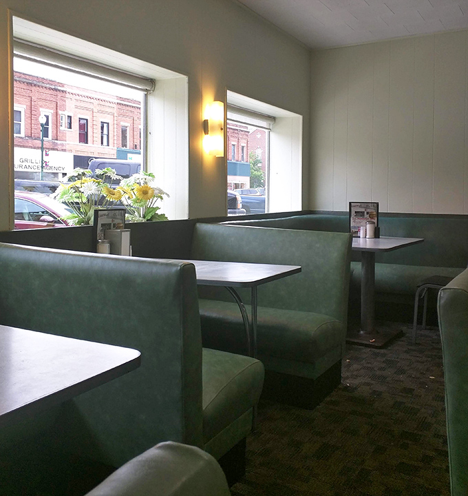 Windows that frame downtown Troy like living paintings. These booths offer front-row seats to both Main Street and comfort food theater. 