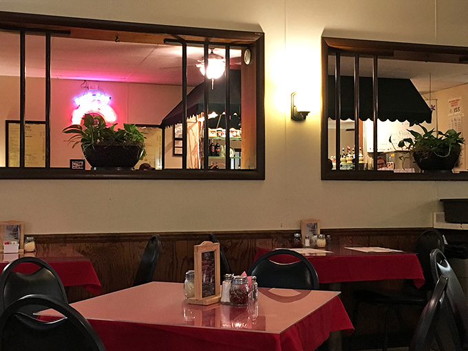 Those interior windows and green awnings create little neighborhoods within the restaurant, perfect for both people-watching and private conversations.