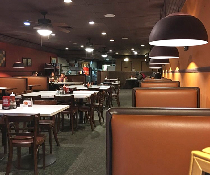 Cozy booths and warm lighting create the kind of atmosphere where food stories and family tales flow as freely as the sweet tea.