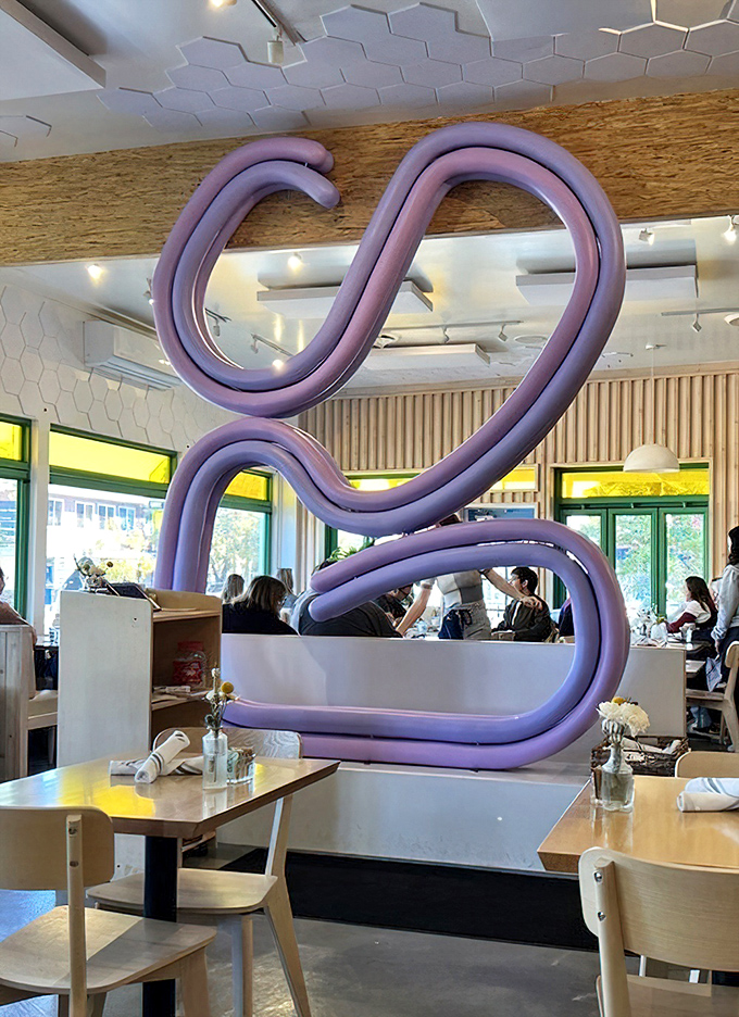 That purple sculptural installation isn't just art—it's a conversation starter that's witnessed countless first dates, family reunions, and "we need to talk" moments.