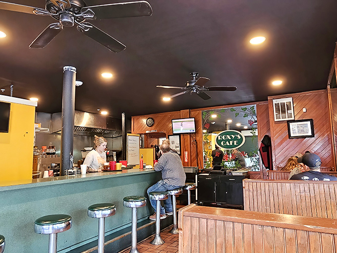 The warm wood paneling and cozy counter create that rare atmosphere where regulars and first-timers alike feel instantly at home.