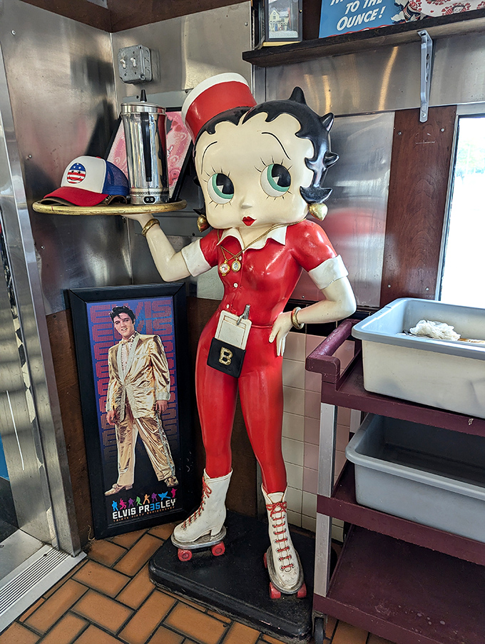 Betty Boop stands guard by the kitchen, a roller-skating sentinel ensuring Elvis gets his peanut butter and banana sandwich just right.