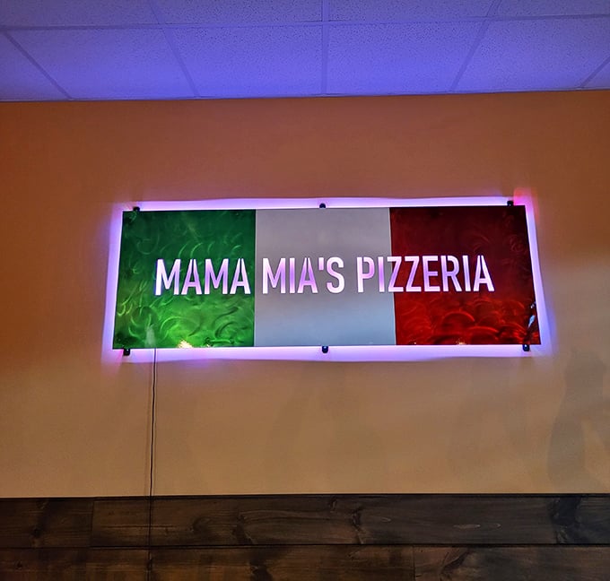 The Italian flag sign glows with promise, like a beacon guiding hungry travelers to pizza salvation.
