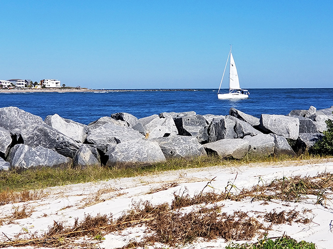Where land meets sea in a dramatic rocky finale &ndash; with sailboats providing the perfect moving scenery for your beachside daydreams.