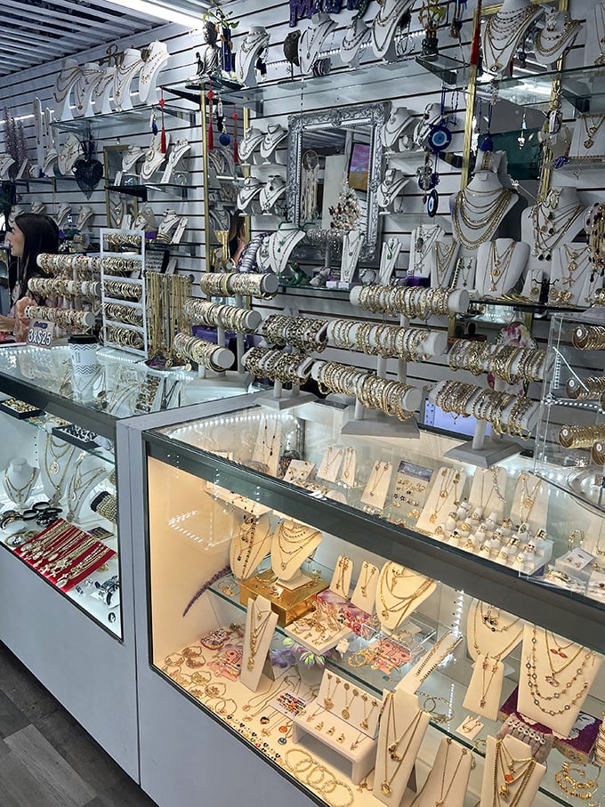 Golden treasures sparkle behind crystal barriers, transforming simple jewelry shopping into a glamorous treasure hunt experience.