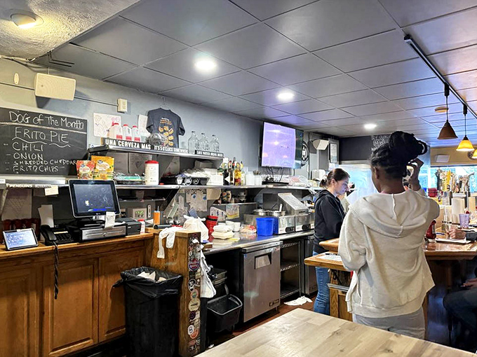 Behind the counter, where the magic happens. The open kitchen layout lets you witness your food's journey from ingredients to masterpiece.