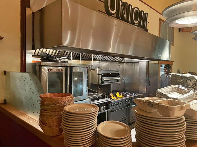 The open kitchen concept lets you witness the culinary magic happening behind every perfectly prepared plate.