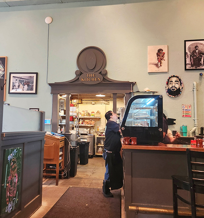 "The Kitchen" archway frames the heart of the operation like a proscenium arch. This is where breakfast dreams become delicious reality.