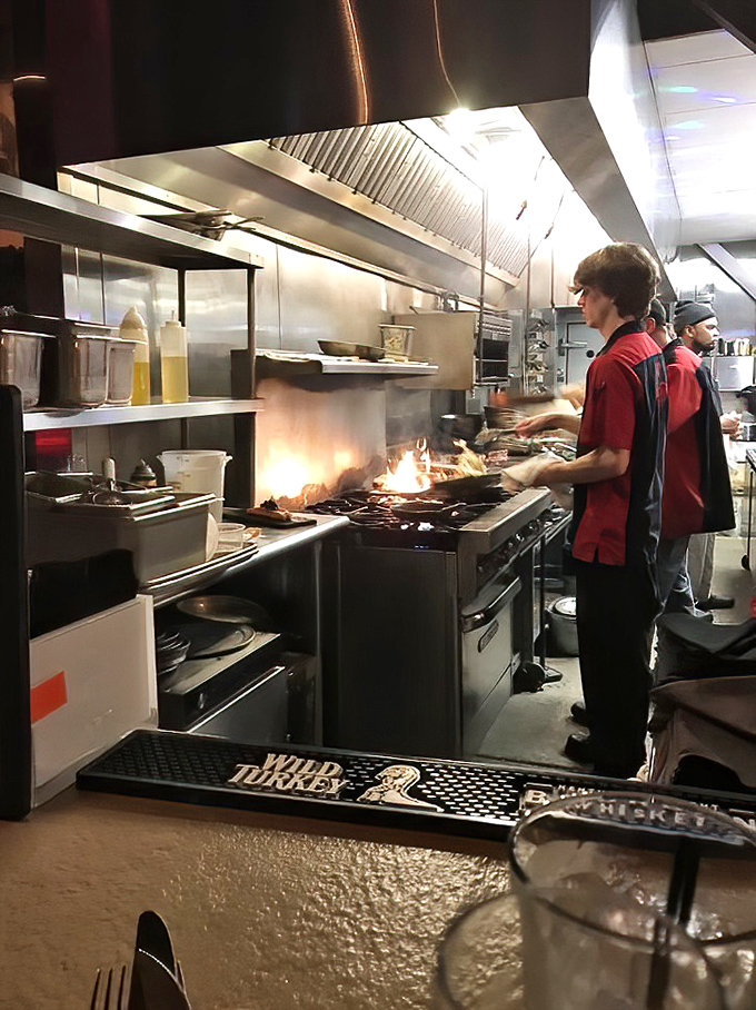 Behind the scenes, flames leap as chefs orchestrate a ballet of sizzle and steam, transforming raw ingredients into edible art.