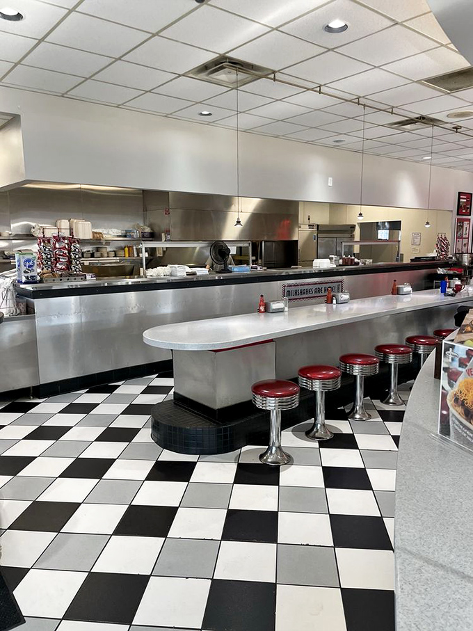 The counter seating offers front-row tickets to the culinary show, where chili masters work their magic with practiced precision.