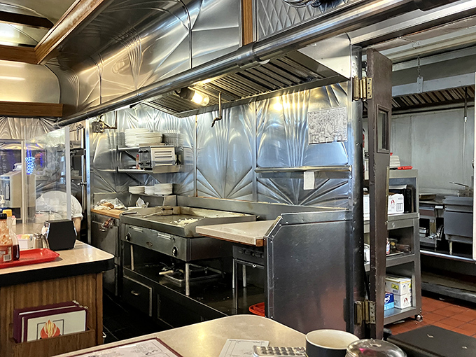 The gleaming stainless steel kitchen where breakfast magic happens. Like watching the backstage of a Broadway show, but with more butter.