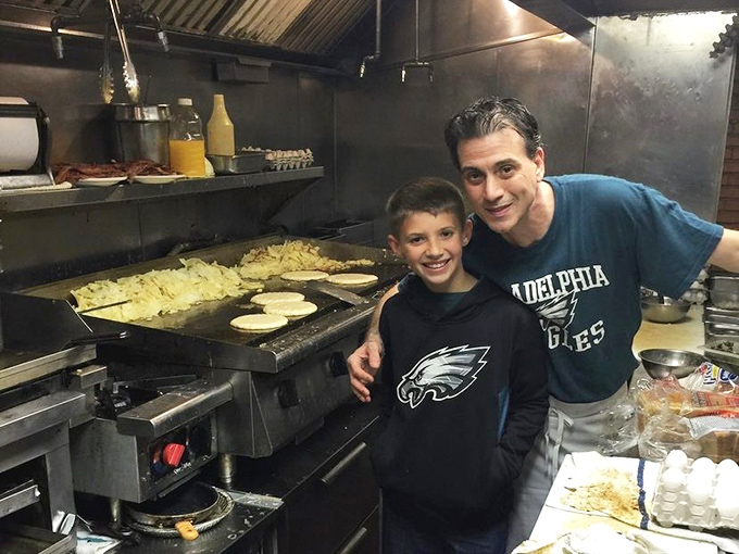 Behind-the-scenes kitchen magic where Eagles fans bond over the universal language of good food and hometown pride.