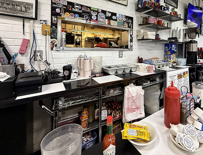 The kitchen pass&mdash;that magical portal where orders go in and breakfast dreams emerge, complete with a squeeze bottle of ketchup standing guard.