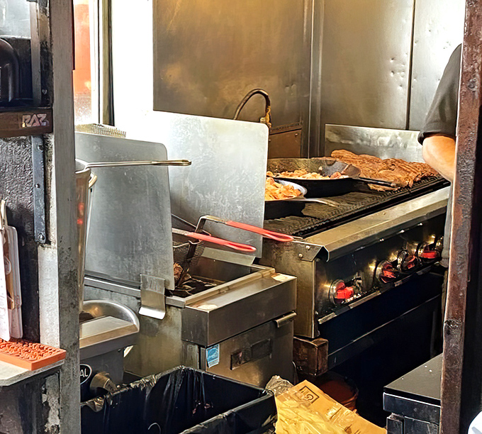 A glimpse into the kitchen where burger magic happens&mdash;no fancy equipment, just well-seasoned grills and decades of know-how.