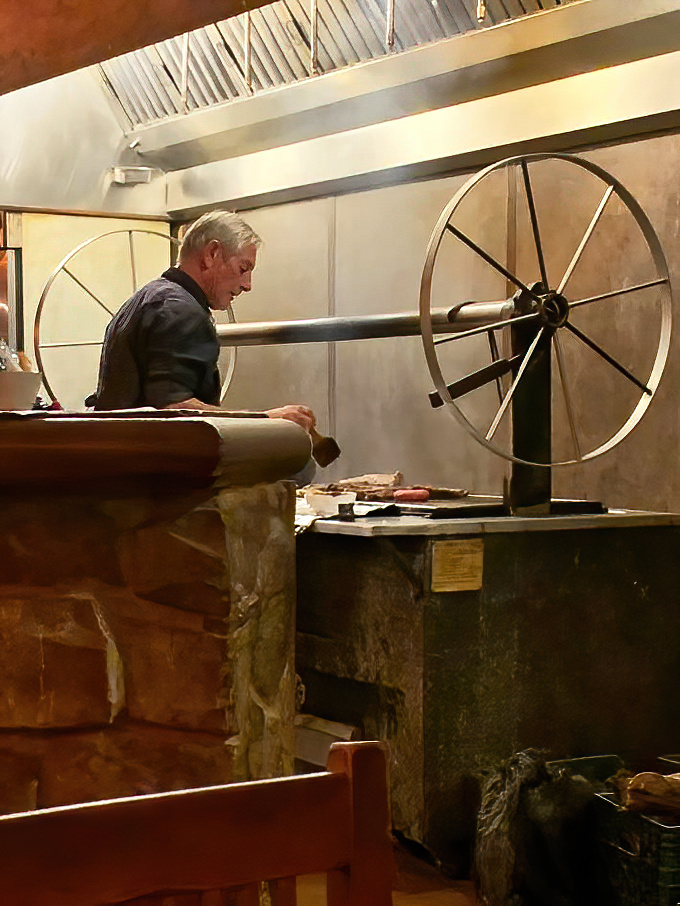 Behind the scenes, the mesquite grill's wagon wheel mechanism is both functional art and a nod to ranching traditions.