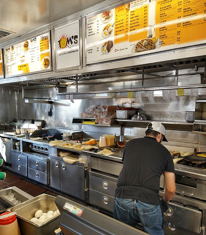 The kitchen symphony in full swing&mdash;spatulas scraping, eggs cracking, and hash browns sizzling create the soundtrack to your perfect morning meal.