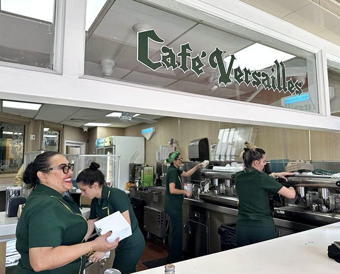 Behind the glass, the coffee wizards work their caffeinated magic with practiced precision.