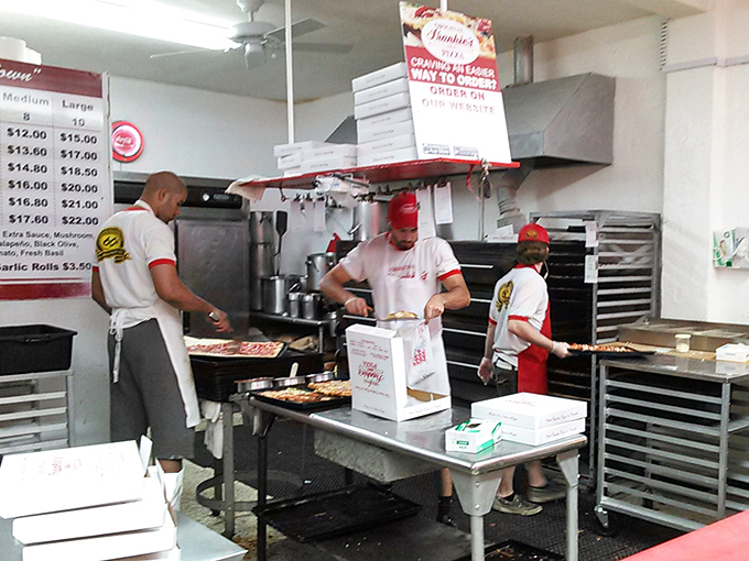 Behind the scenes, the pizza-making ballet continues as it has for decades &ndash; practiced hands creating edible masterpieces with methodical precision.