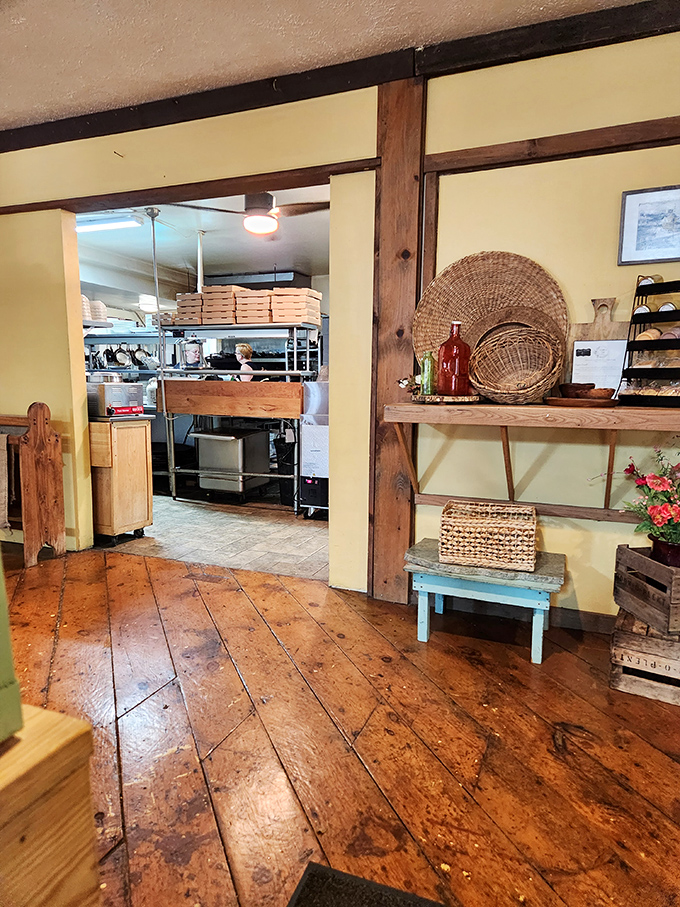 The kitchen doorway reveals the behind-the-scenes magic, where rustic meets refined in a space that honors traditional craftsmanship.