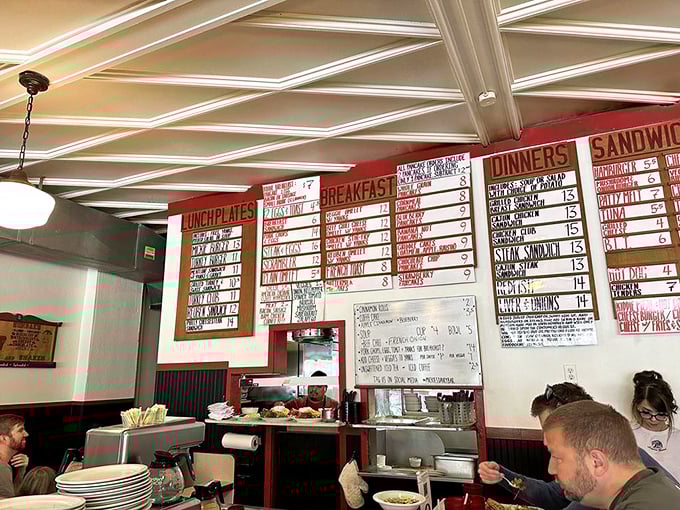 The menu board wall&mdash;a masterclass in hand-lettering and the art of making impossible breakfast decisions before coffee kicks in.