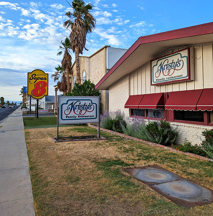 Kristy's Family Restaurant stands as a testament to desert dining longevity, where generations have gathered for comfort food under those swaying palms.