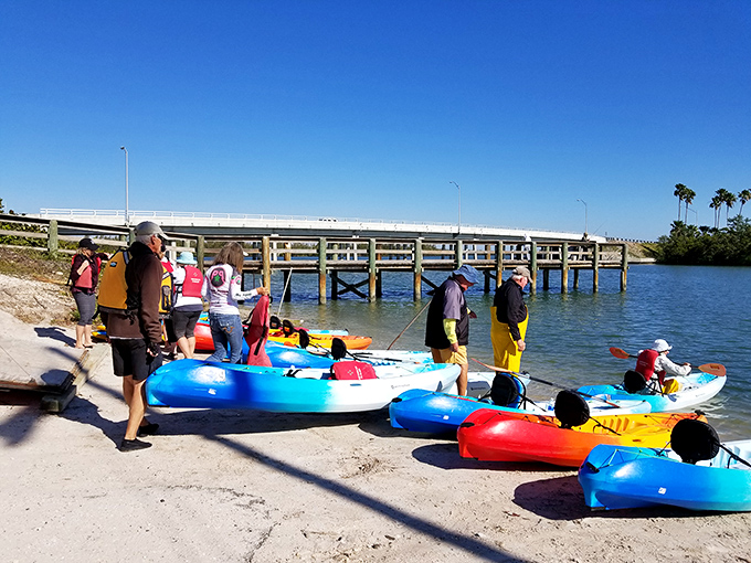 Colorful kayaks await adventure at Little Jim Bridge Park &ndash; floating chariots ready to transport explorers through Fort Pierce's aquatic wonderland.