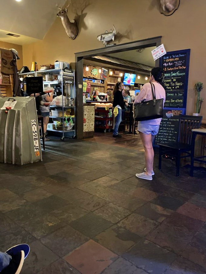 The entrance area doubles as a charming market, where deer mounts watch over specialty foods that beg to be taken home.