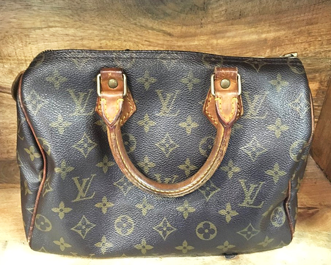 A gently-used Louis Vuitton that doesn't require explaining to your financial advisor. Designer dreams at digestible prices.