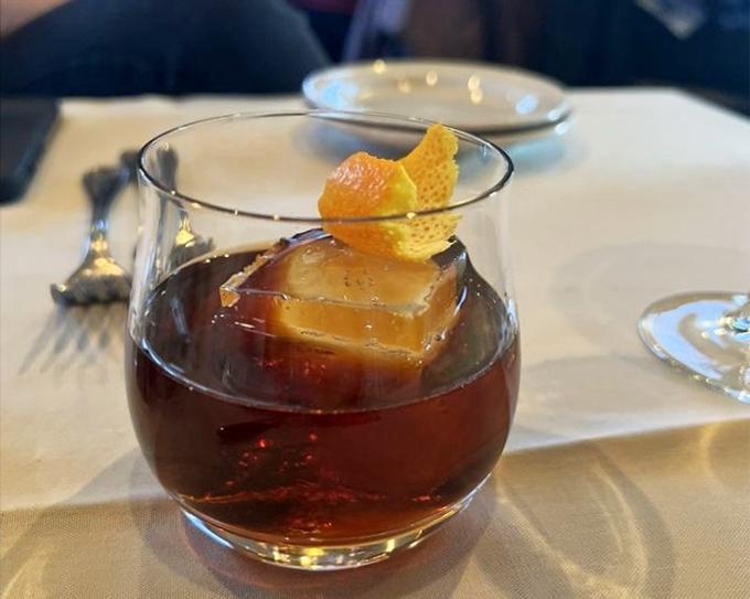 A proper Manhattan cocktail signals serious bartending skills and attention to detail throughout the establishment.