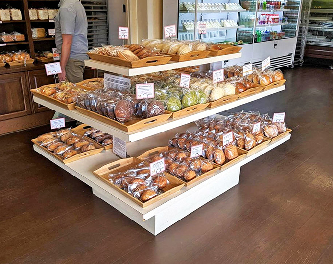 The bread display is a carbohydrate museum where each exhibit deserves both your reverence and your appetite.